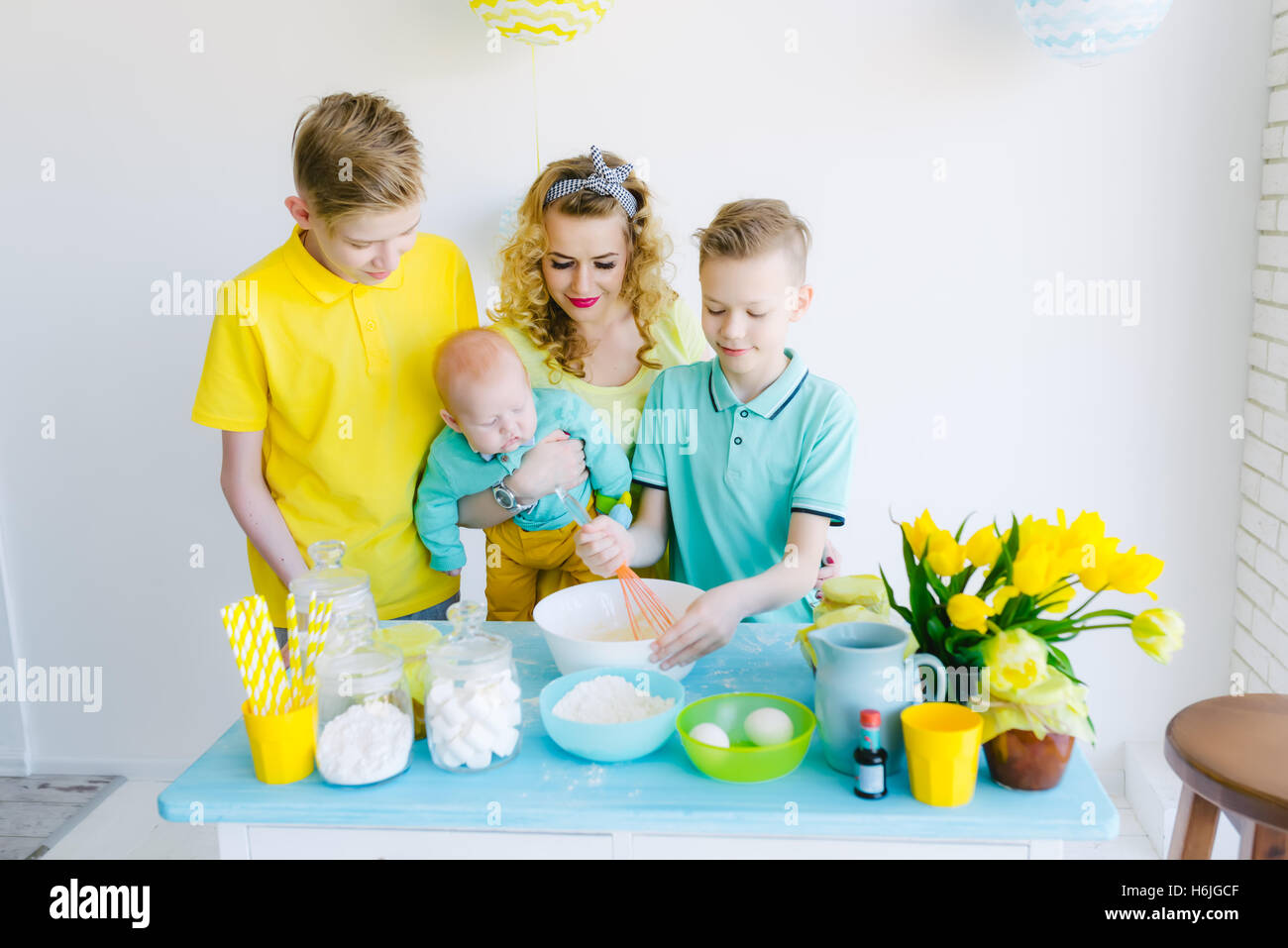The family makes baking in the kitchen Stock Photo - Alamy