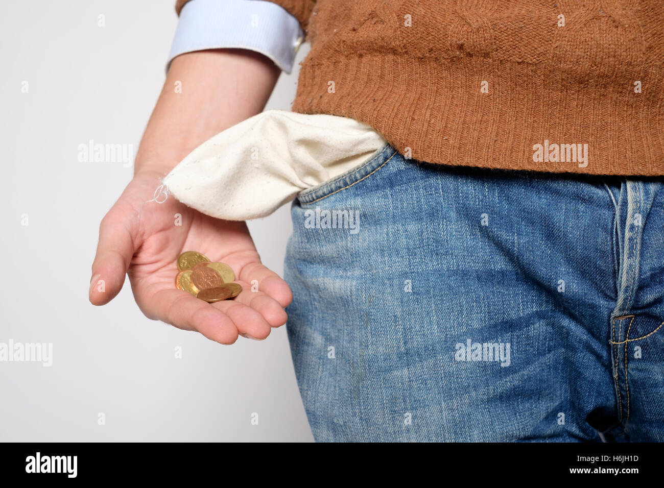 Man opens his pockets and there is no money Stock Photo - Alamy