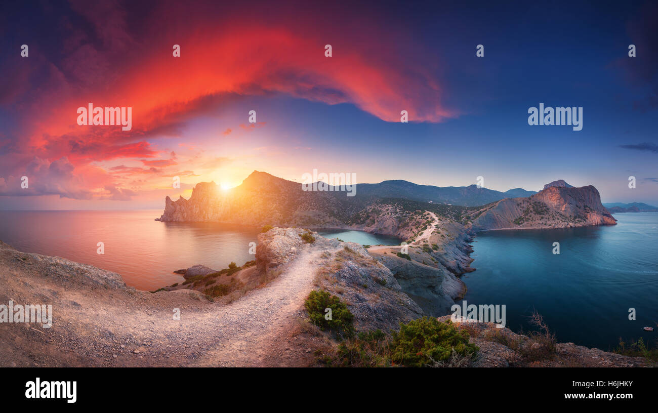 Amazing summer landscape with mountains, sea, blue sky, sun and ...