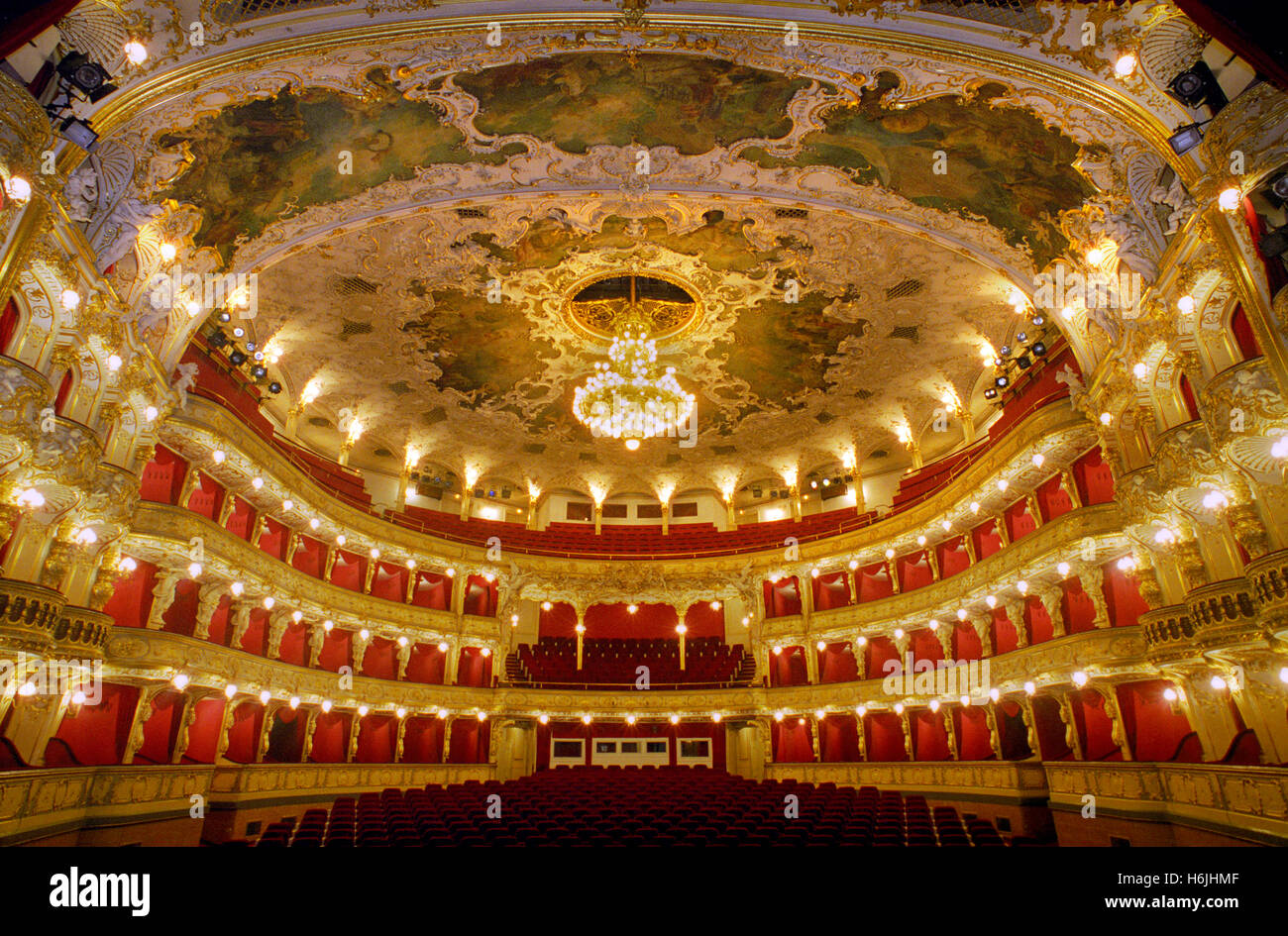 Prague State Opera House wide baroque lit interior auditorium viewed ...