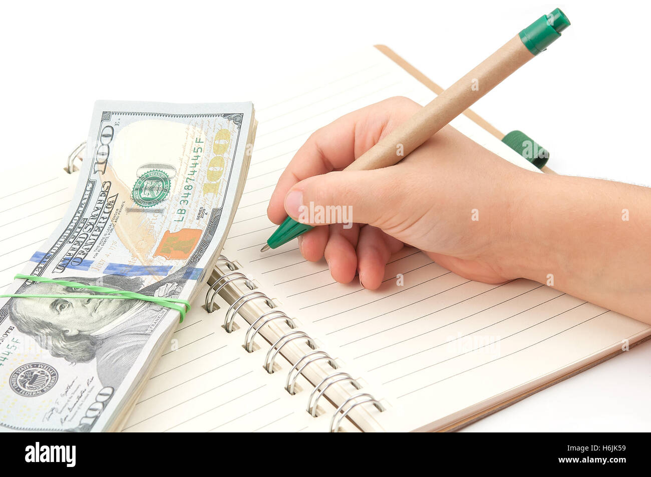 hand with pen and money isolated on white background Stock Photo - Alamy