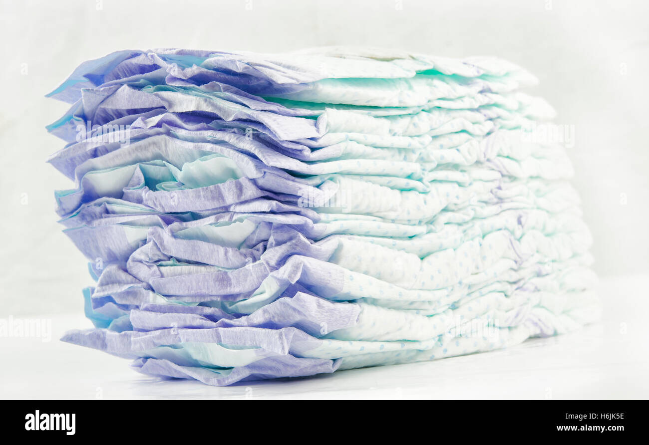 stack of diapers isolated on white background Stock Photo - Alamy