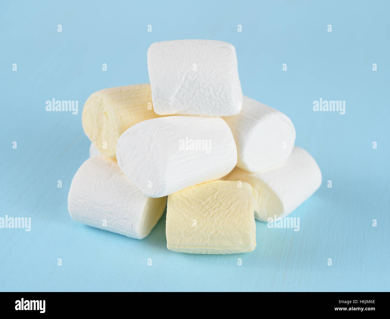 Pile of marshmallow on blue table Stock Photo - Alamy