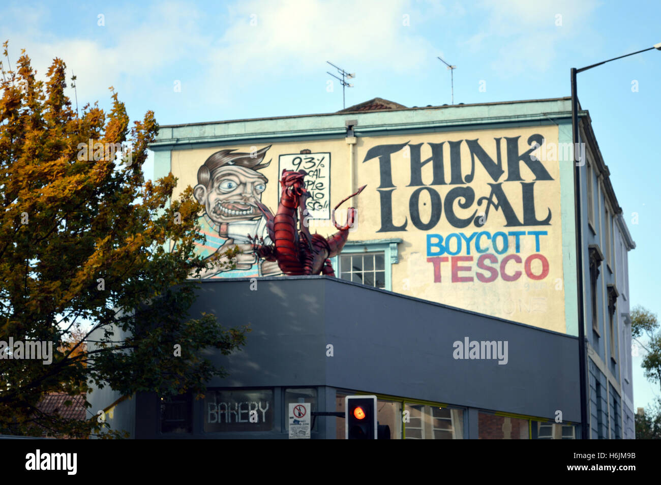 "Think local - boycott Tesco" graffiti on a wall of a house in Stokes ...
