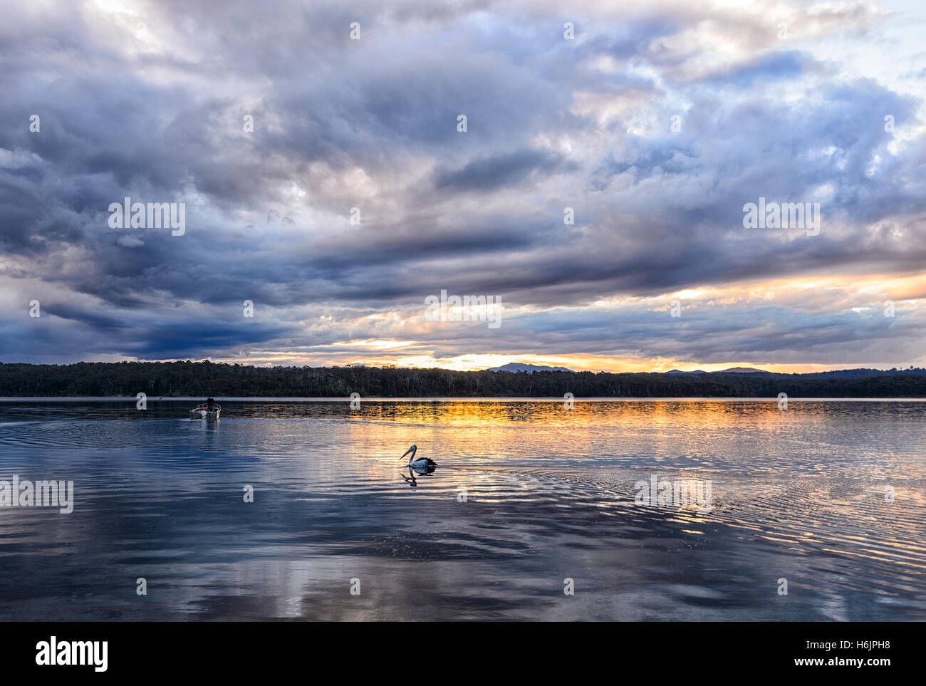 Sunset and threatening clouds over Wallaga Lake, near Bermagui, New ...