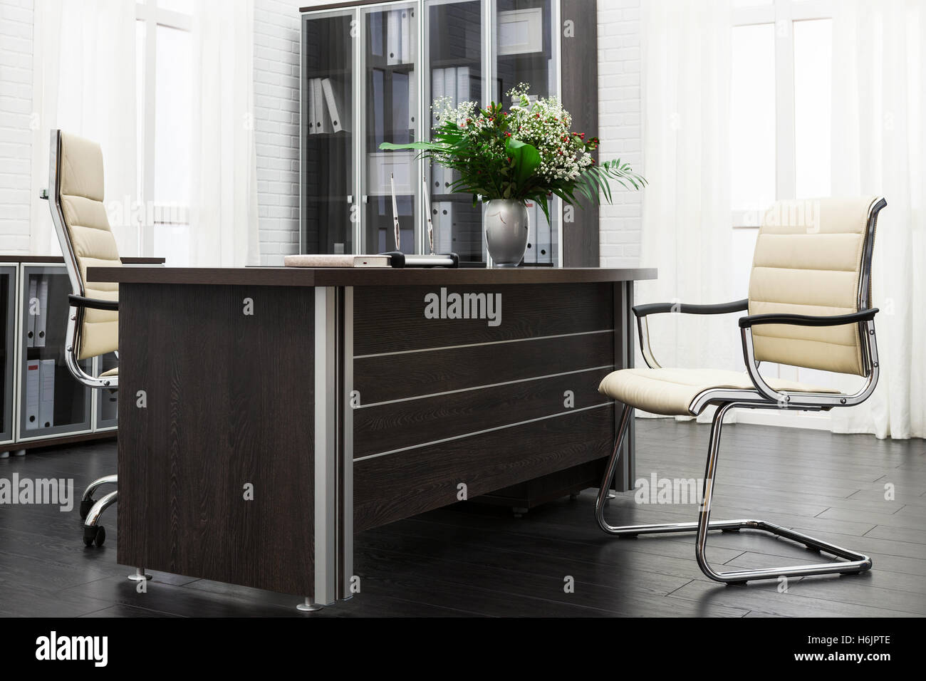 bouquet of flowers on a desk at modern office Stock Photo - Alamy