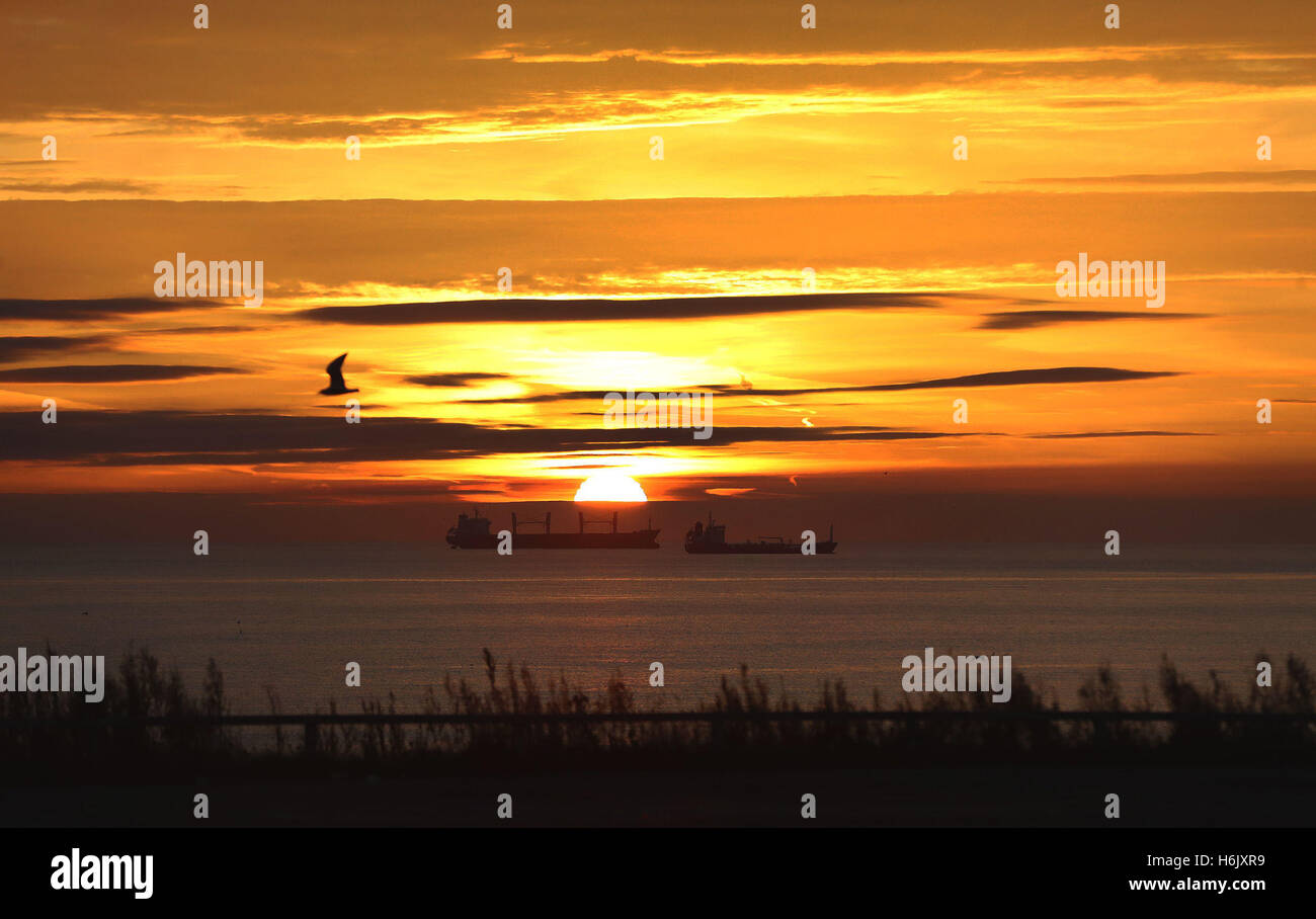Ships out at sea off Whitley Bay beach before sunrise Stock Photo - Alamy