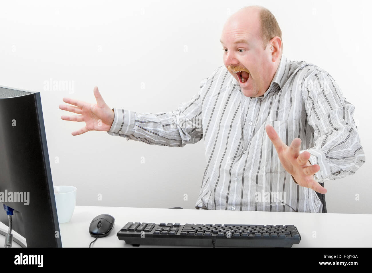 Surprised Businessman Gesturing While Looking At Computer Stock Photo ...