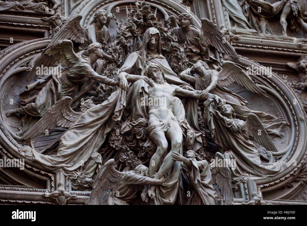 Detail of the Pieta scene in bas-relief at Milan's Cathedral doors ...