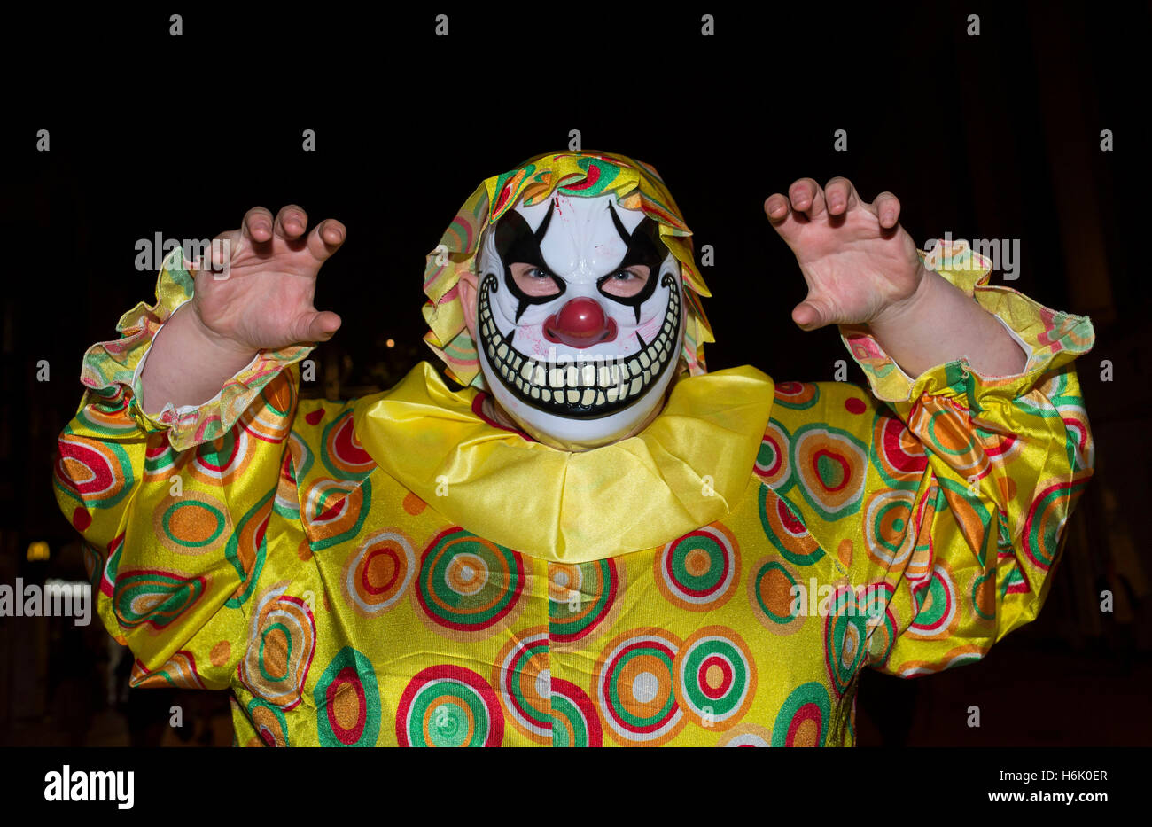 Scary creepy clown out at night on Halloween in Cardiff, South Wales ...