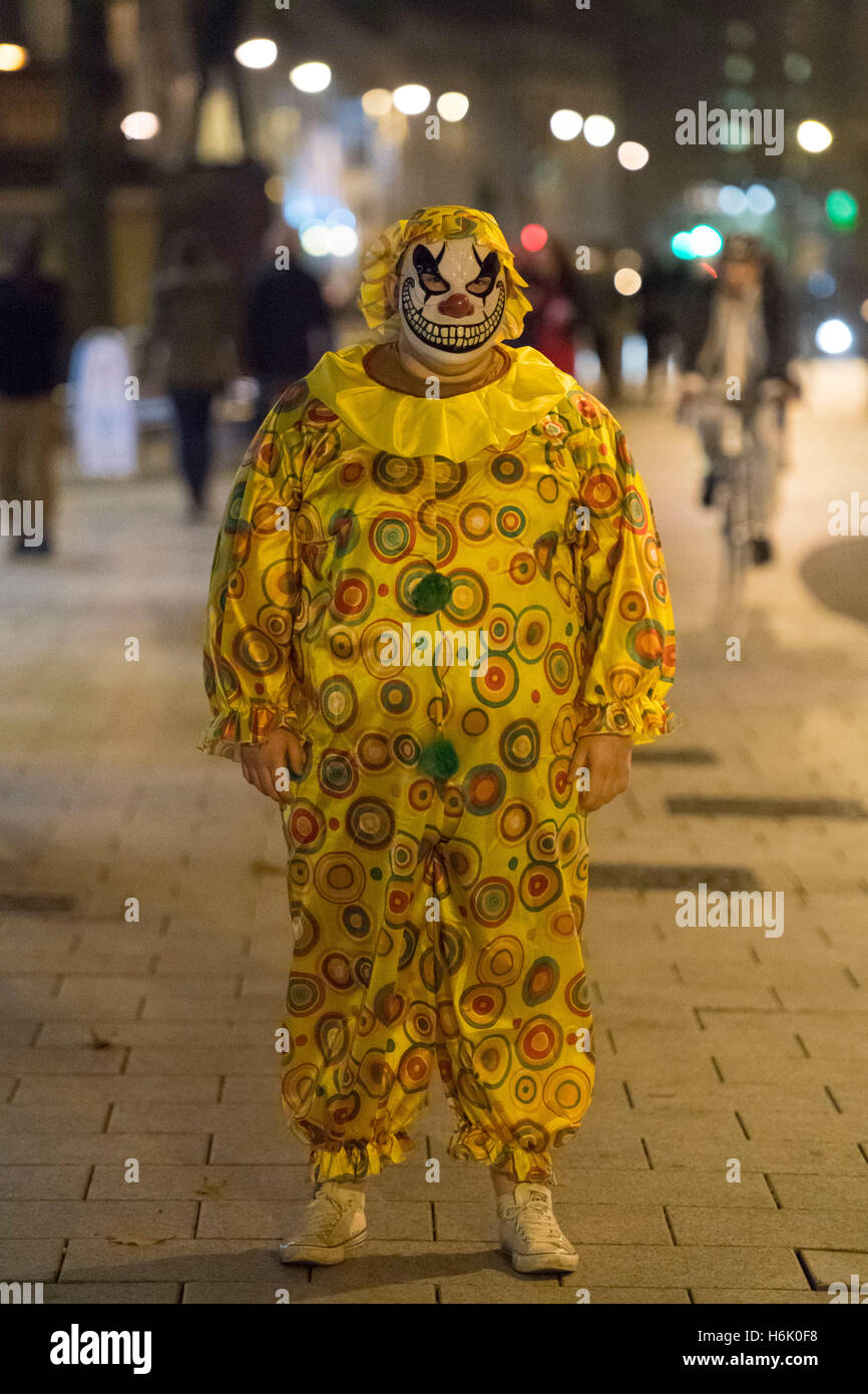 Scary creepy clown out at night on Halloween in Cardiff, South Wales ...
