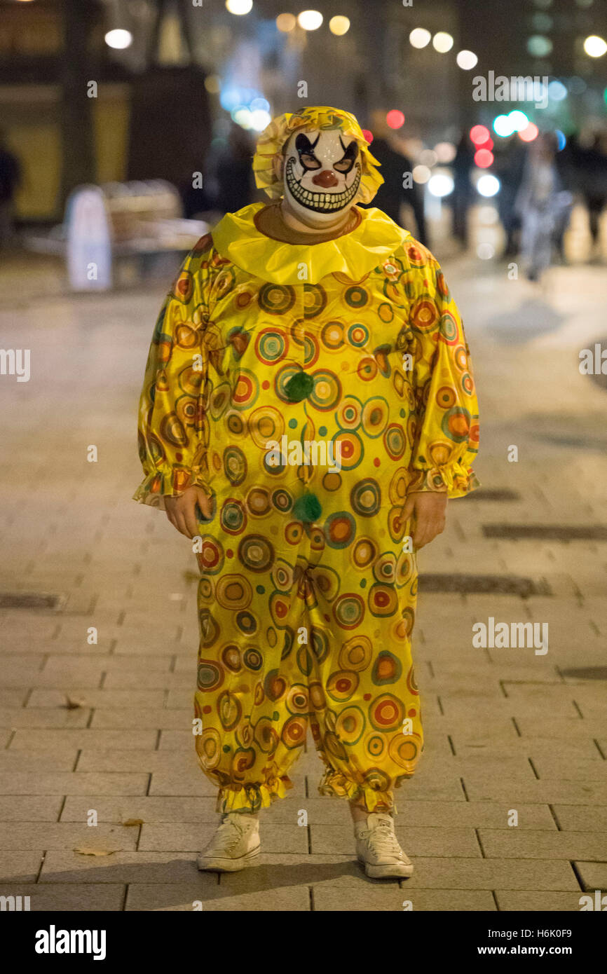 Scary creepy clown out at night on Halloween in Cardiff, South Wales ...