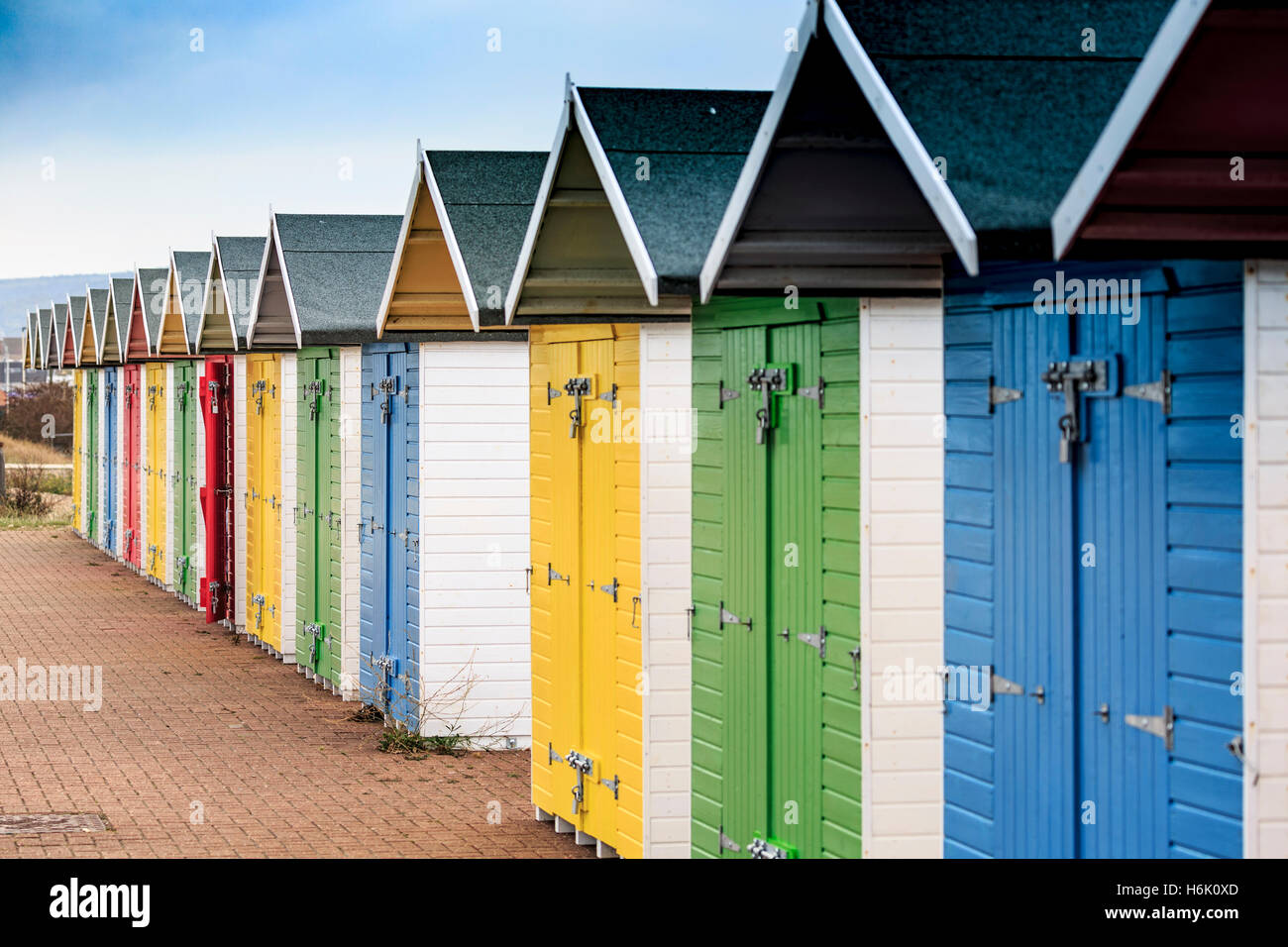 Multicoloured seaside changing huts Stock Photo - Alamy
