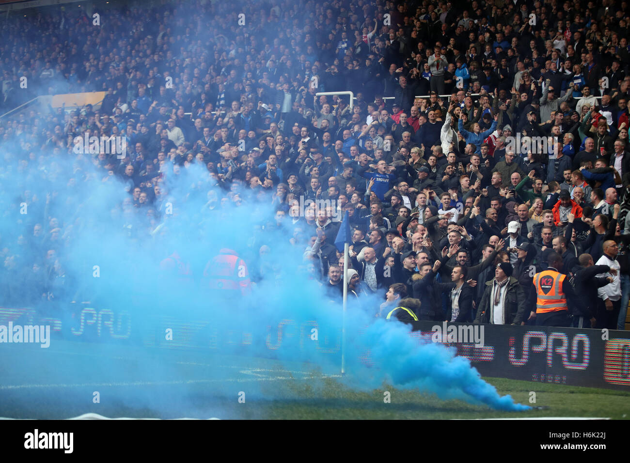 A blue flare is thrown onto the pitch during the Sky Bet Championship ...