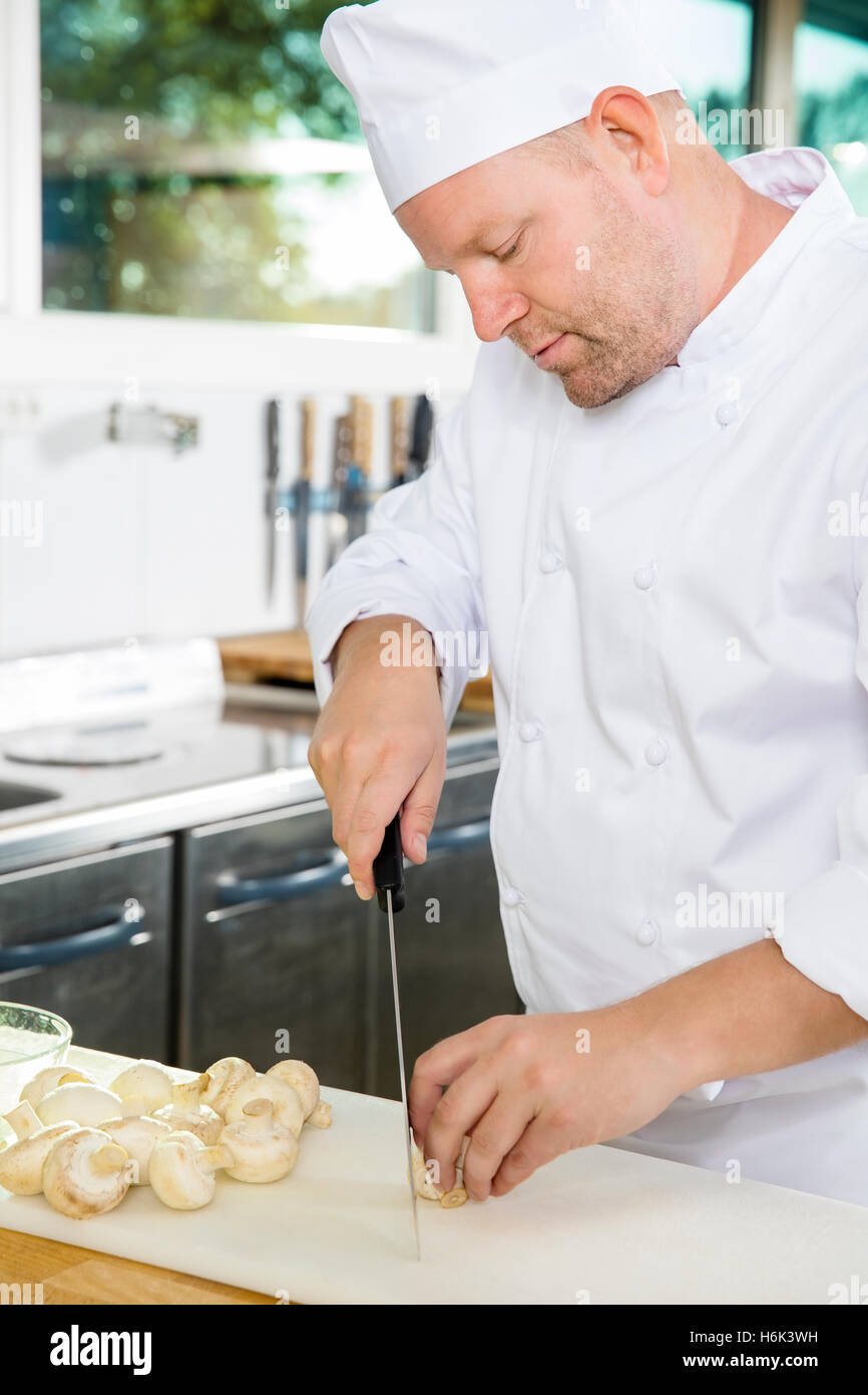 Professional chef preparing vegetables to a healthy dish Stock Photo ...