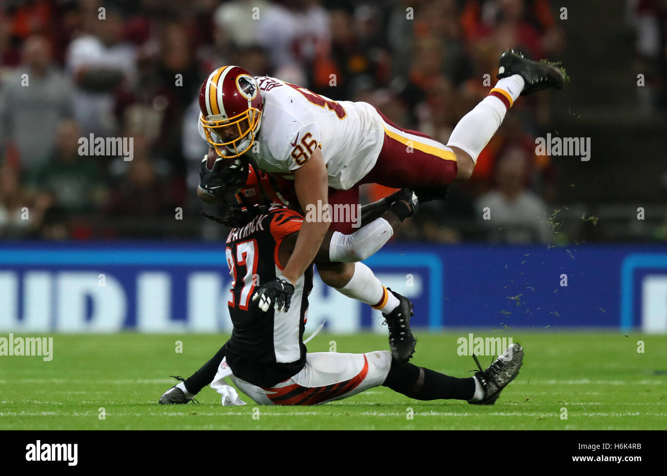 Washington Redskins Tight End Jordan Reed (top) is tackled by ...