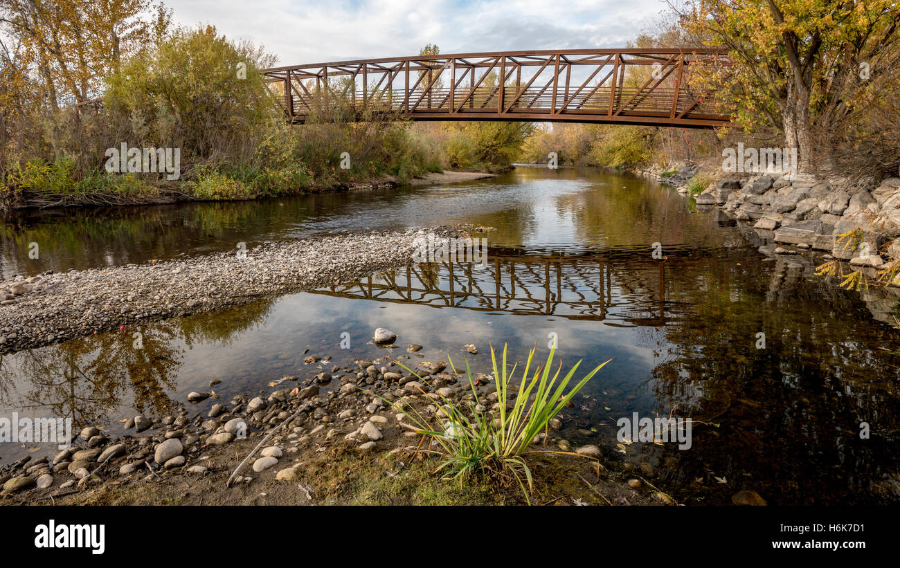 Metal foot bridge spans across the Boise River Stock Photo - Alamy