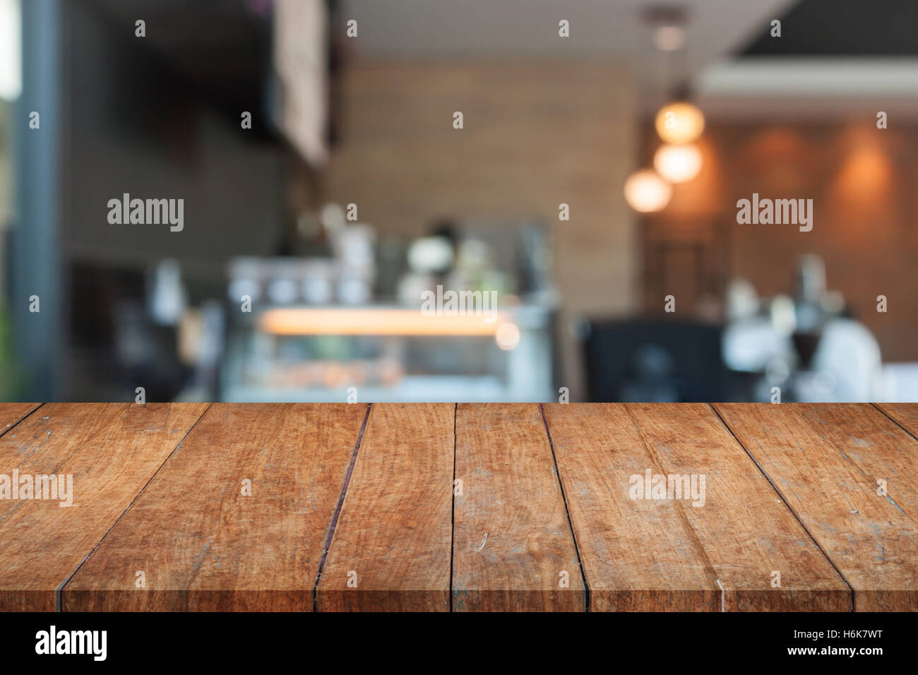 Perspective top brown wooden with blurred coffee shop. product display ...