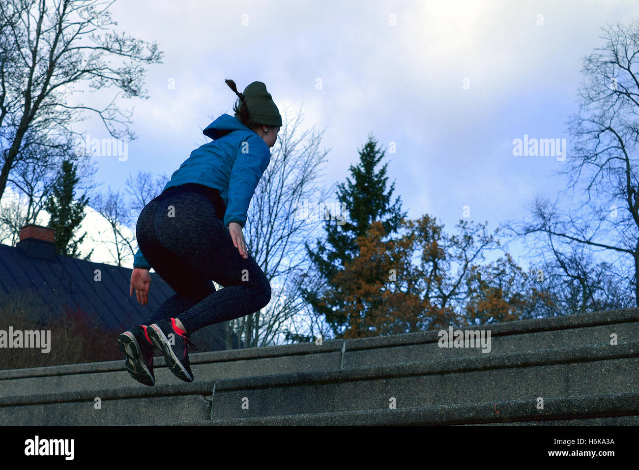 Workout. Teenager jumping stairs Stock Photo - Alamy