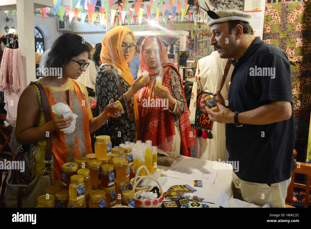 Lahore. 30th Oct, 2016. People visit a stall during an Art and Craft ...