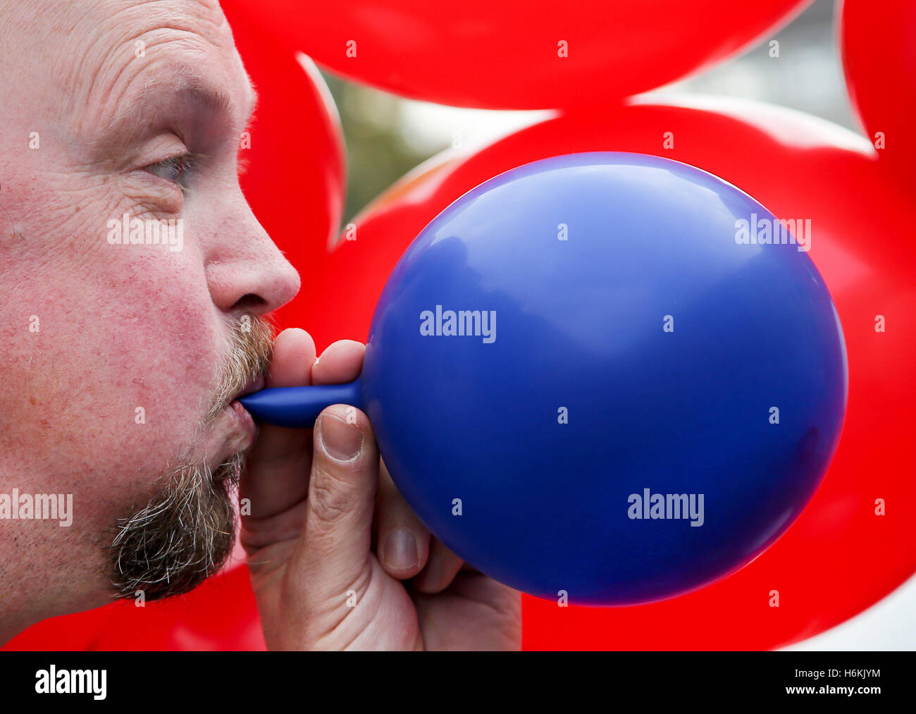 Blowing up balloons hi-res stock photography and images - Alamy