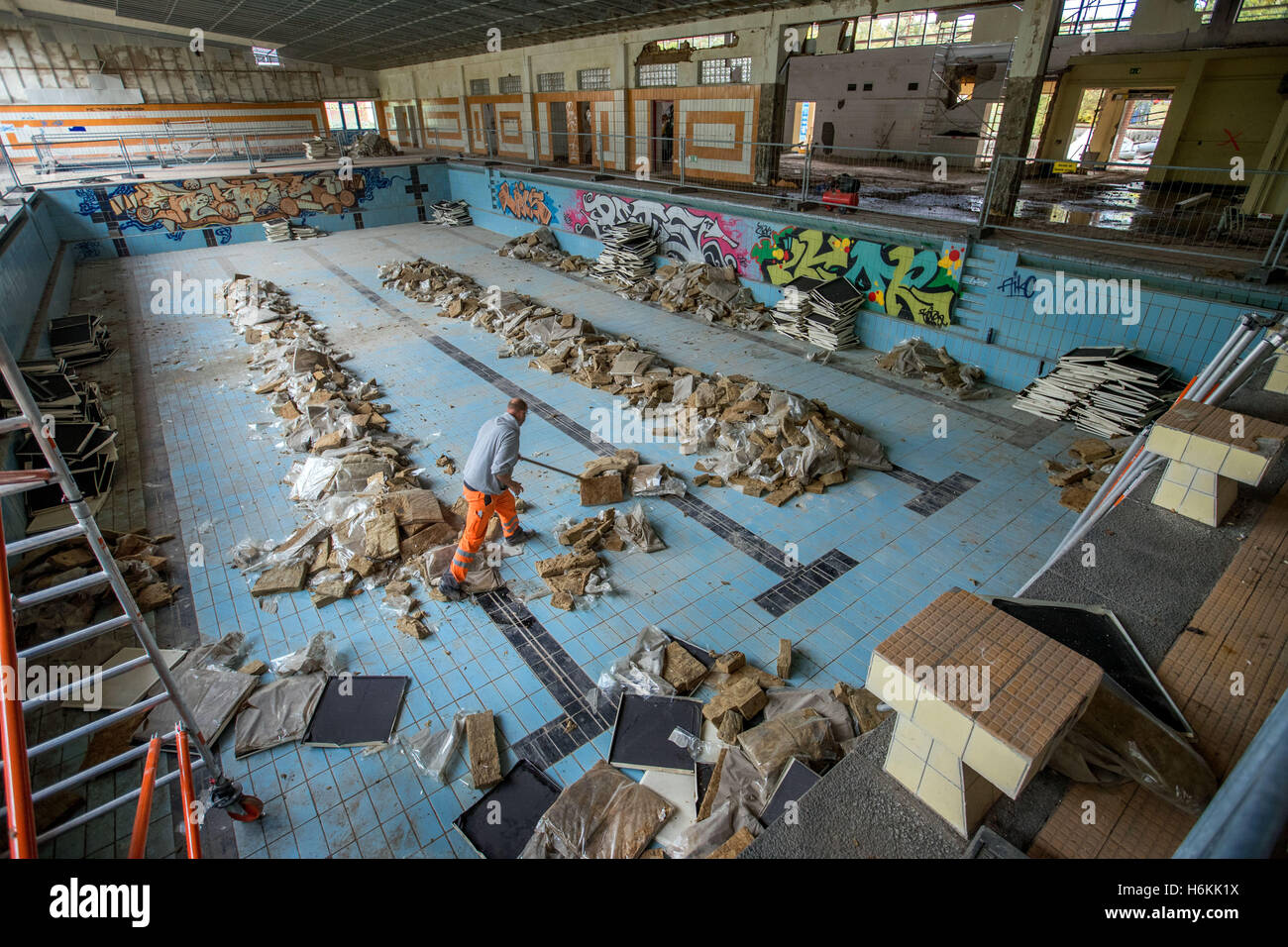 A man works in the former 'people's swimming pool' in the district of ...