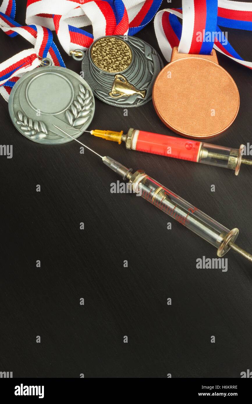 Syringe and medals. Doping in sport. Abuse of anabolic steroids for ...