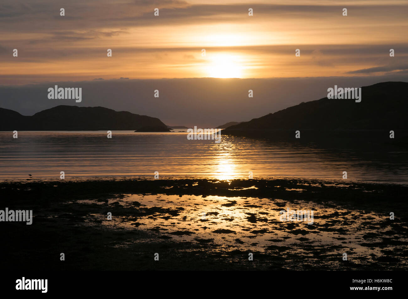 The autumn sun setting on Loch Inver, Scotland Stock Photo - Alamy