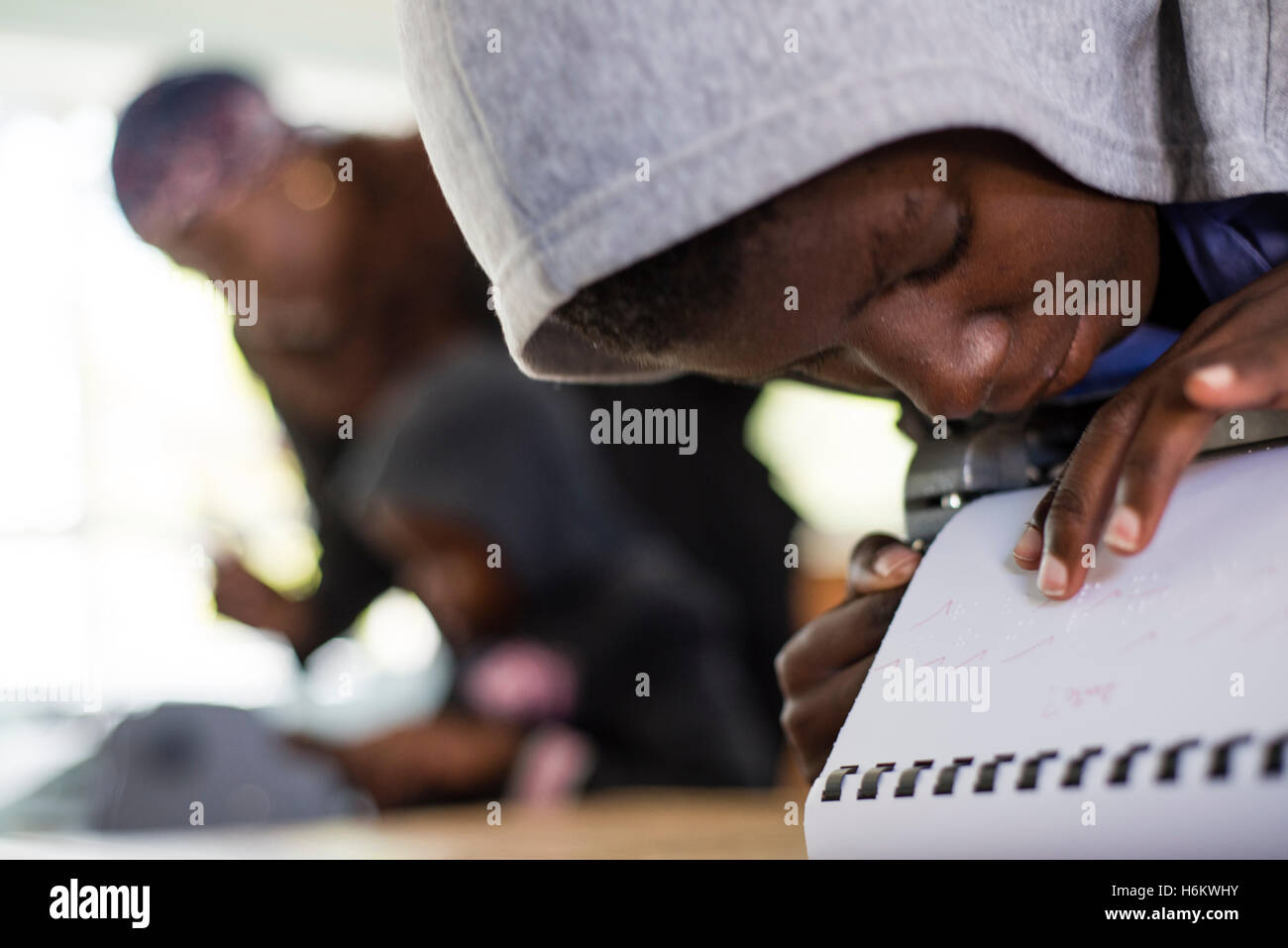 A learner of the Eluwa Special School types on a typewriter during ...