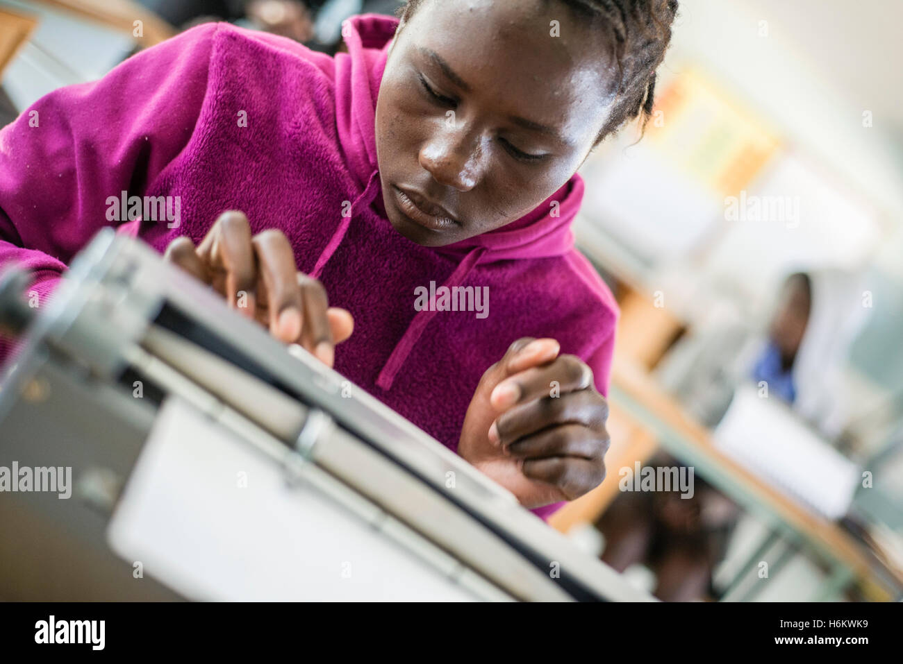 A learner of the Eluwa Special School types on a typewriter during the ...