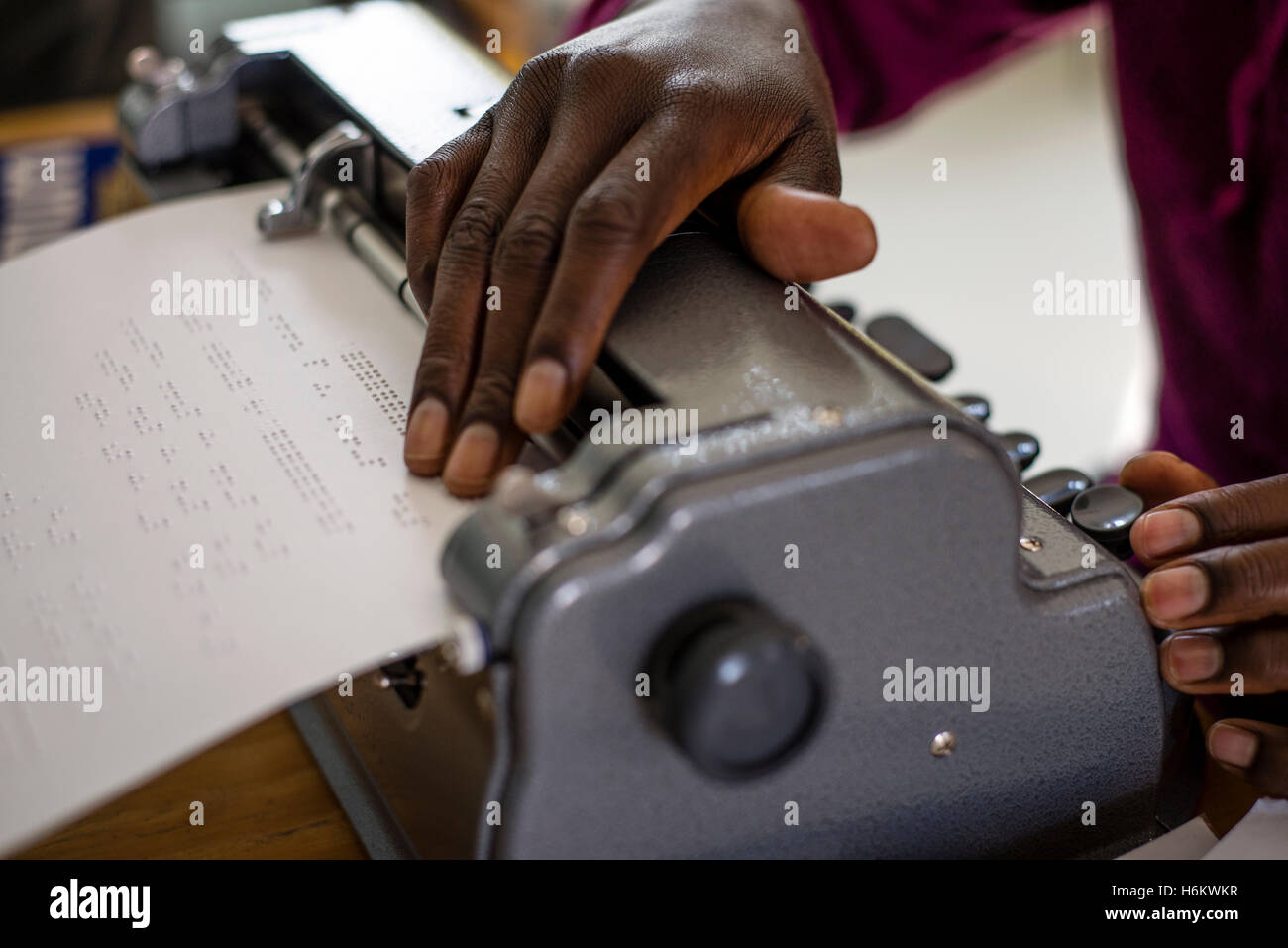 A learner of the Eluwa Special School types on a typewriter during ...