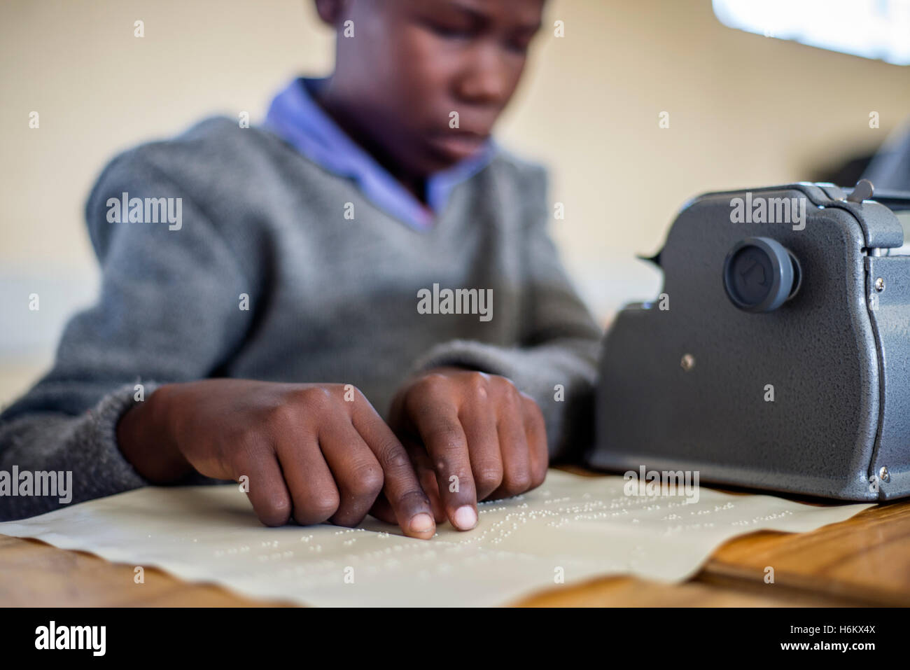 Learners of the Eluwa Special School types on a typewriter during ...