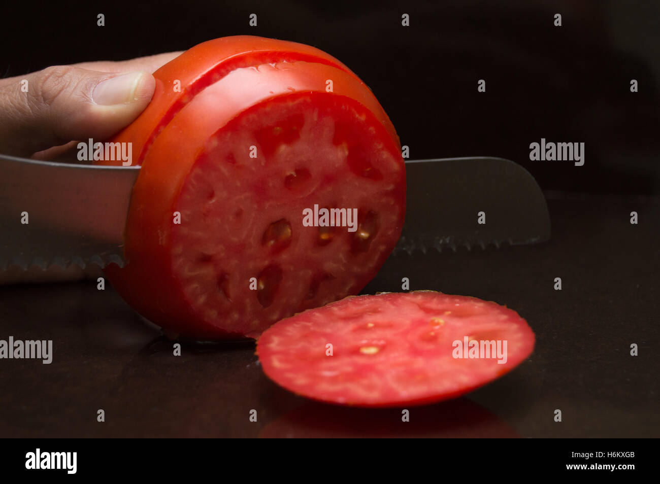 Slicing tomato hi-res stock photography and images - Alamy
