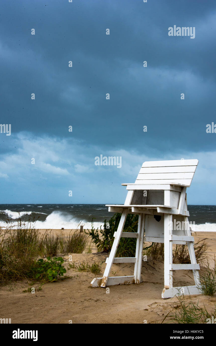 Lifeguards chair on a sandy tropical beach during a storm or hurricane ...