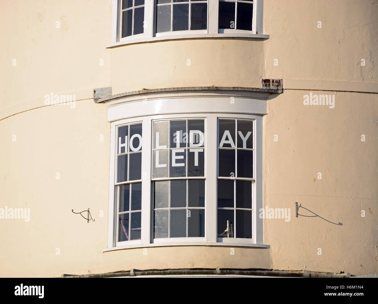 Holiday let sign in a guesthouse window along the Esplanade promenade ...
