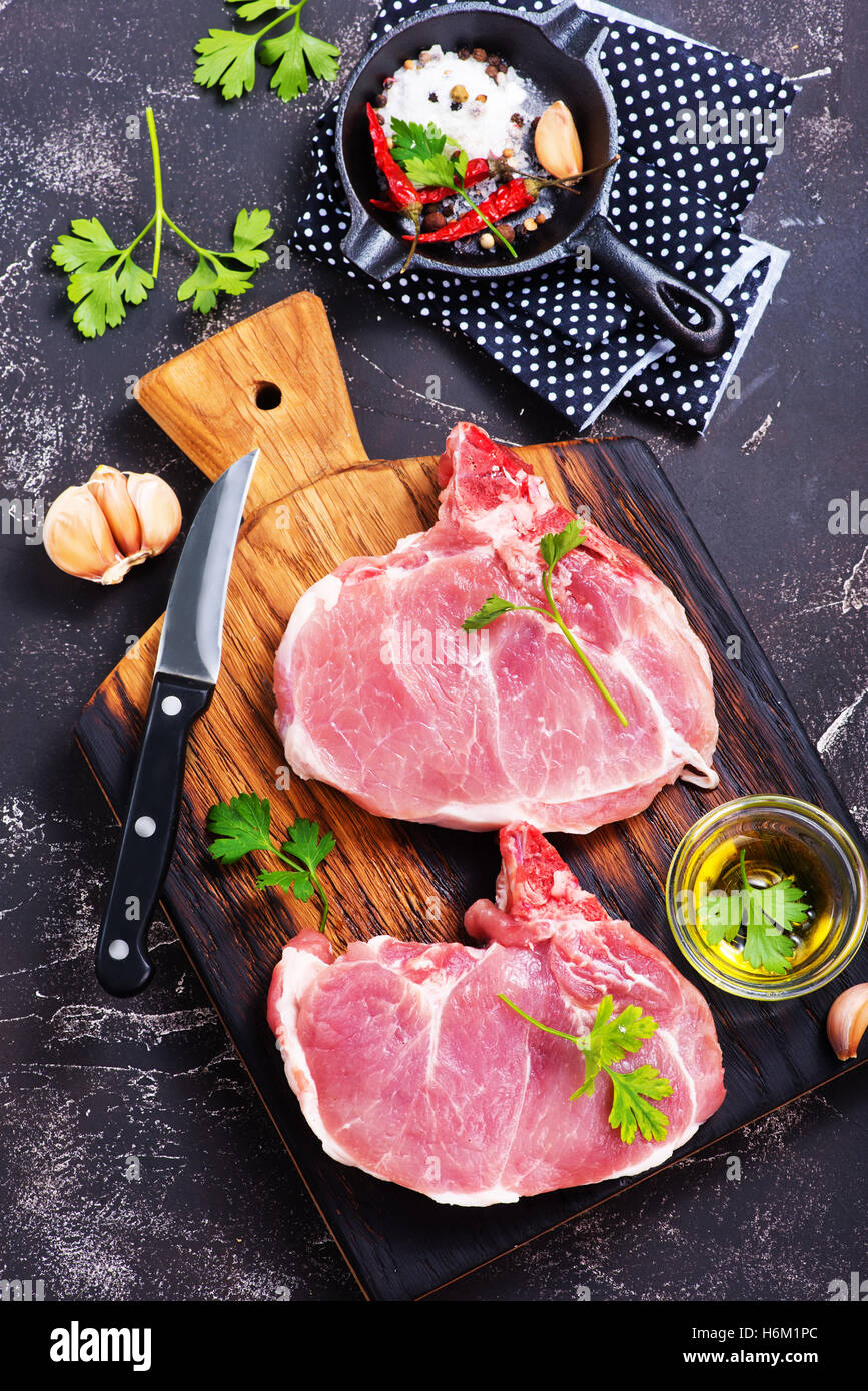 raw meat with aroma spice on a table Stock Photo - Alamy