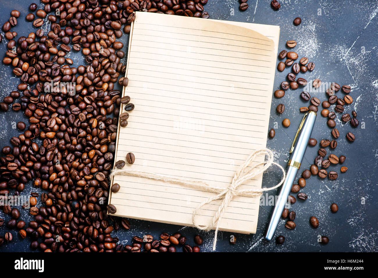 coffee beans and note on a table Stock Photo - Alamy