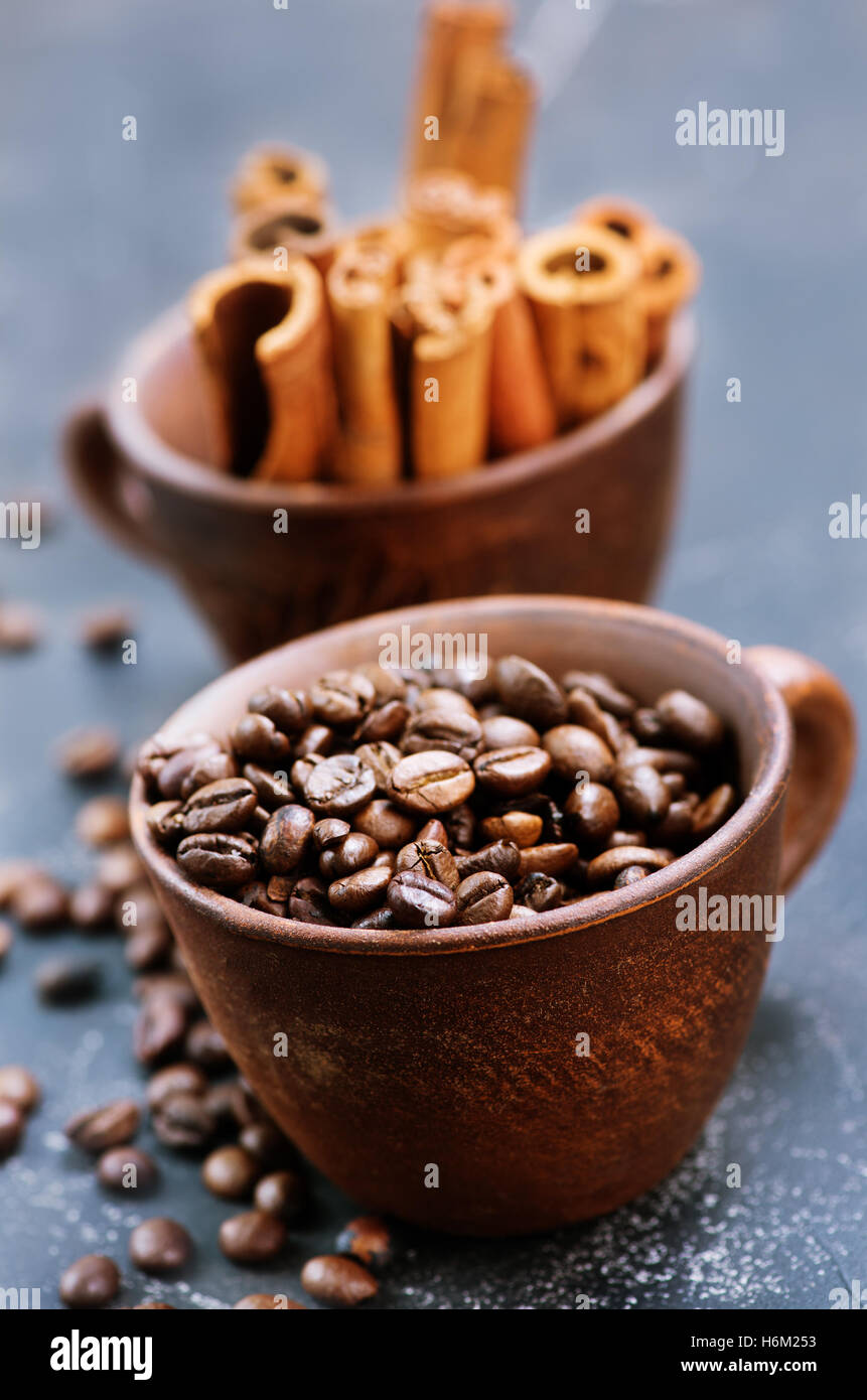 coffee beans in cup and on a table Stock Photo - Alamy