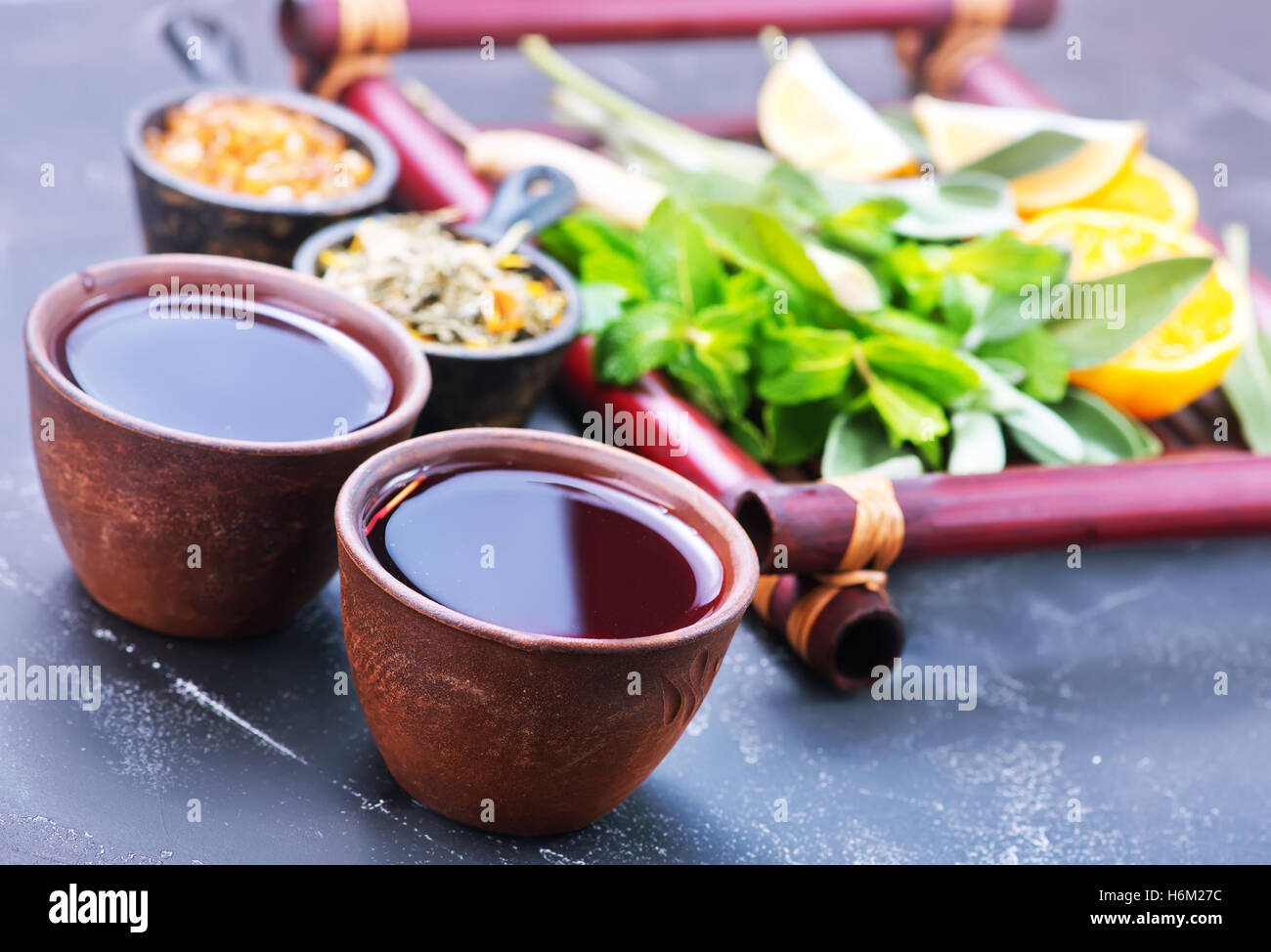 fresh tea in cups and on a table Stock Photo - Alamy
