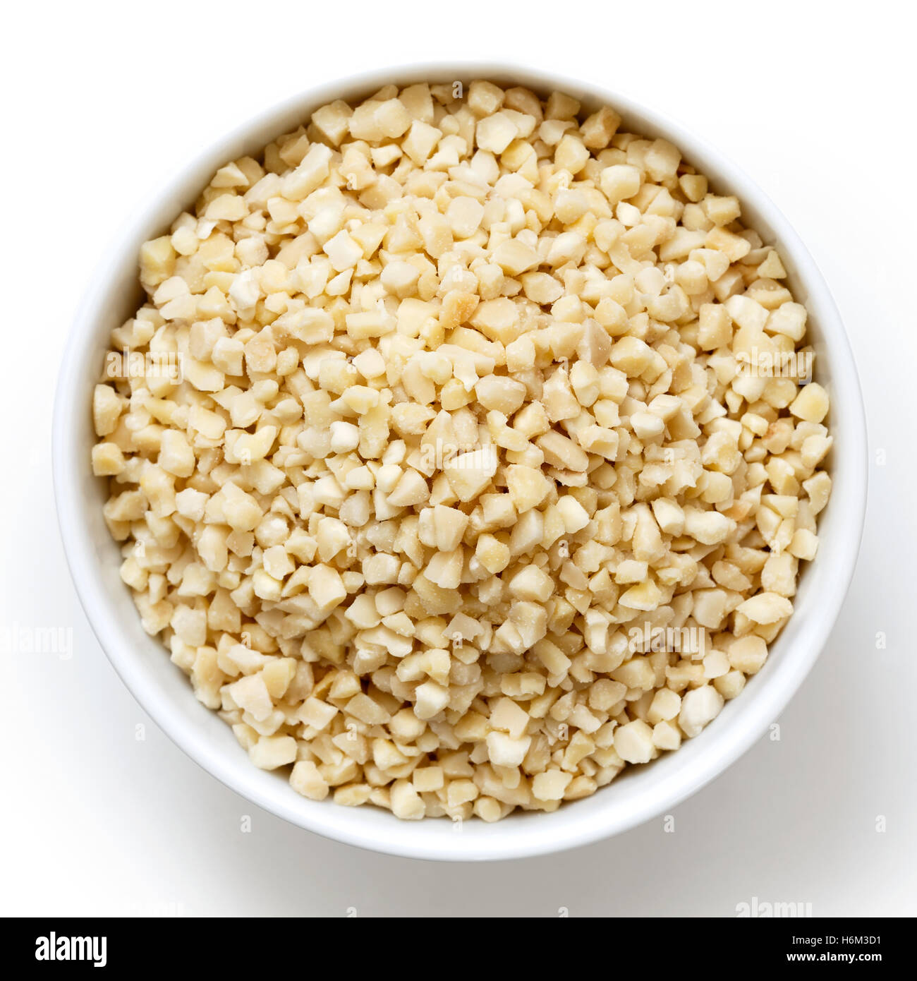 Bowl of peeled chopped almonds isolated on white from above Stock Photo ...