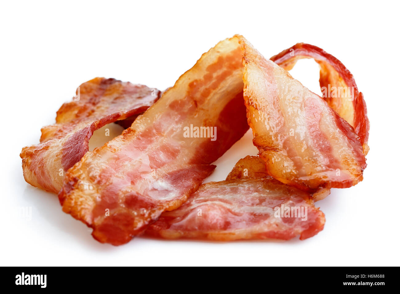 Three strips of fried crispy bacon isolated on white Stock Photo - Alamy