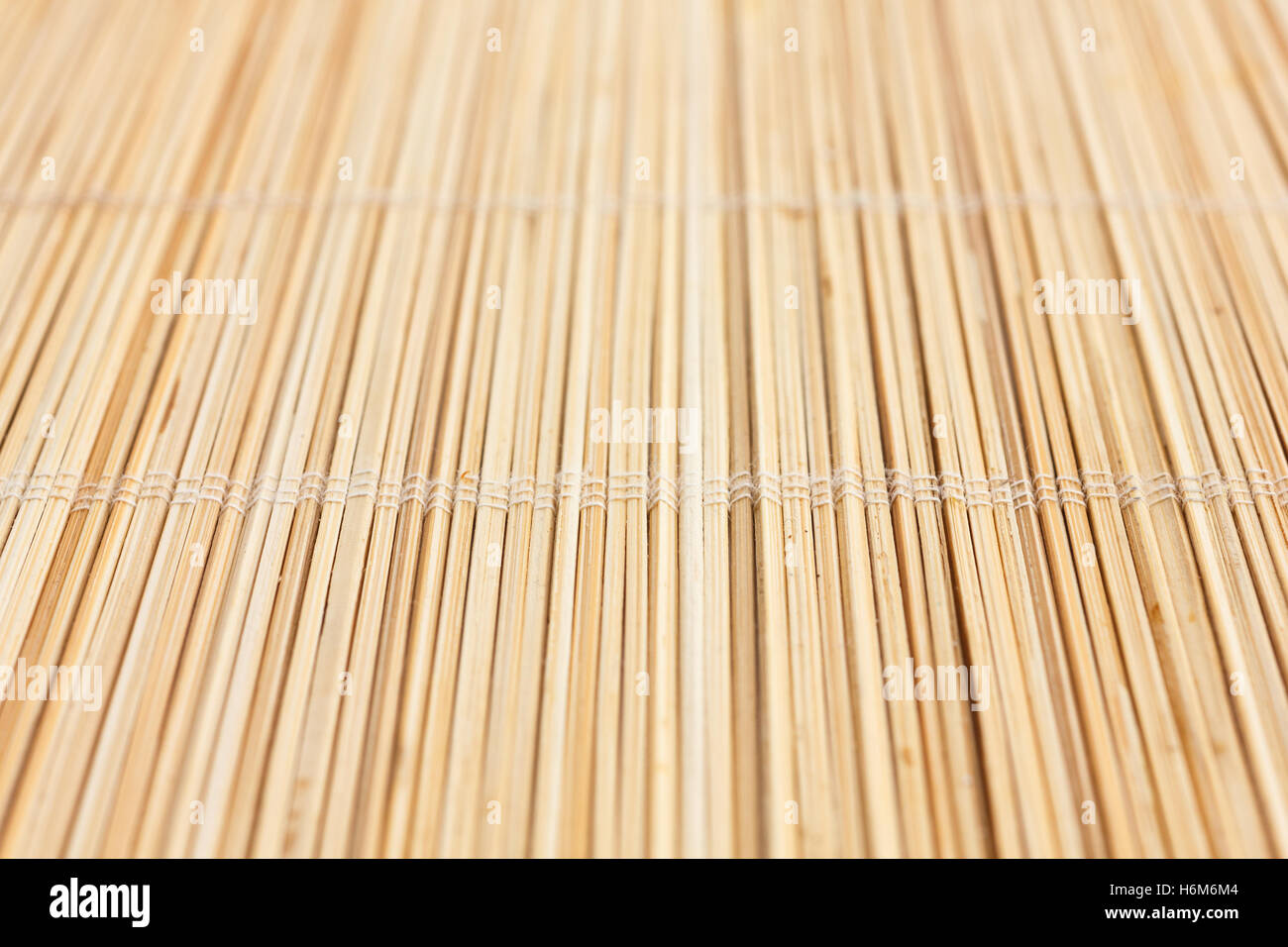 Thin light colored bamboo mat in perspective Stock Photo - Alamy