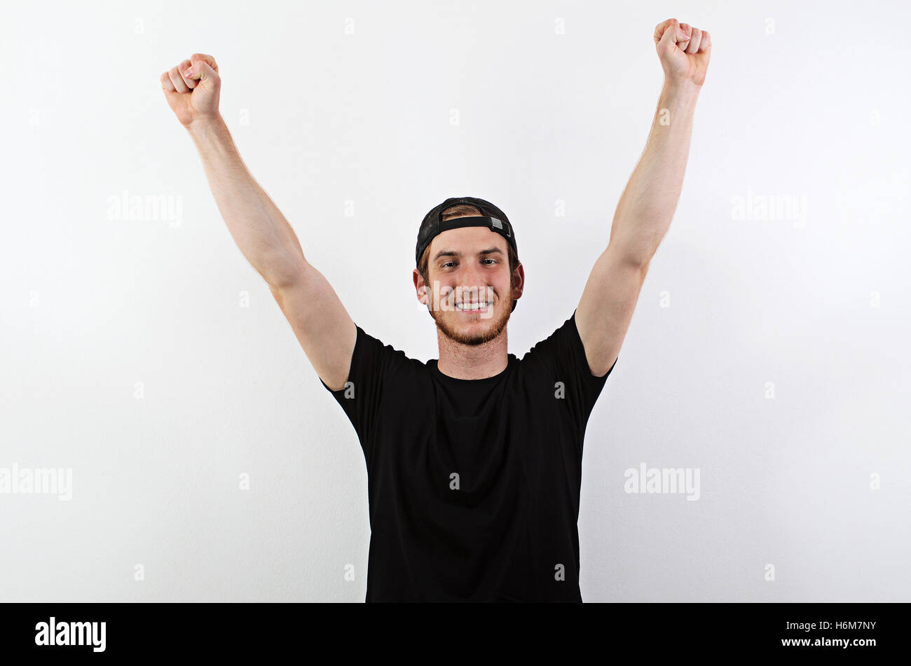 Smiling Young Adult Male in Dark T-Shirt and Baseball Hat Worn ...