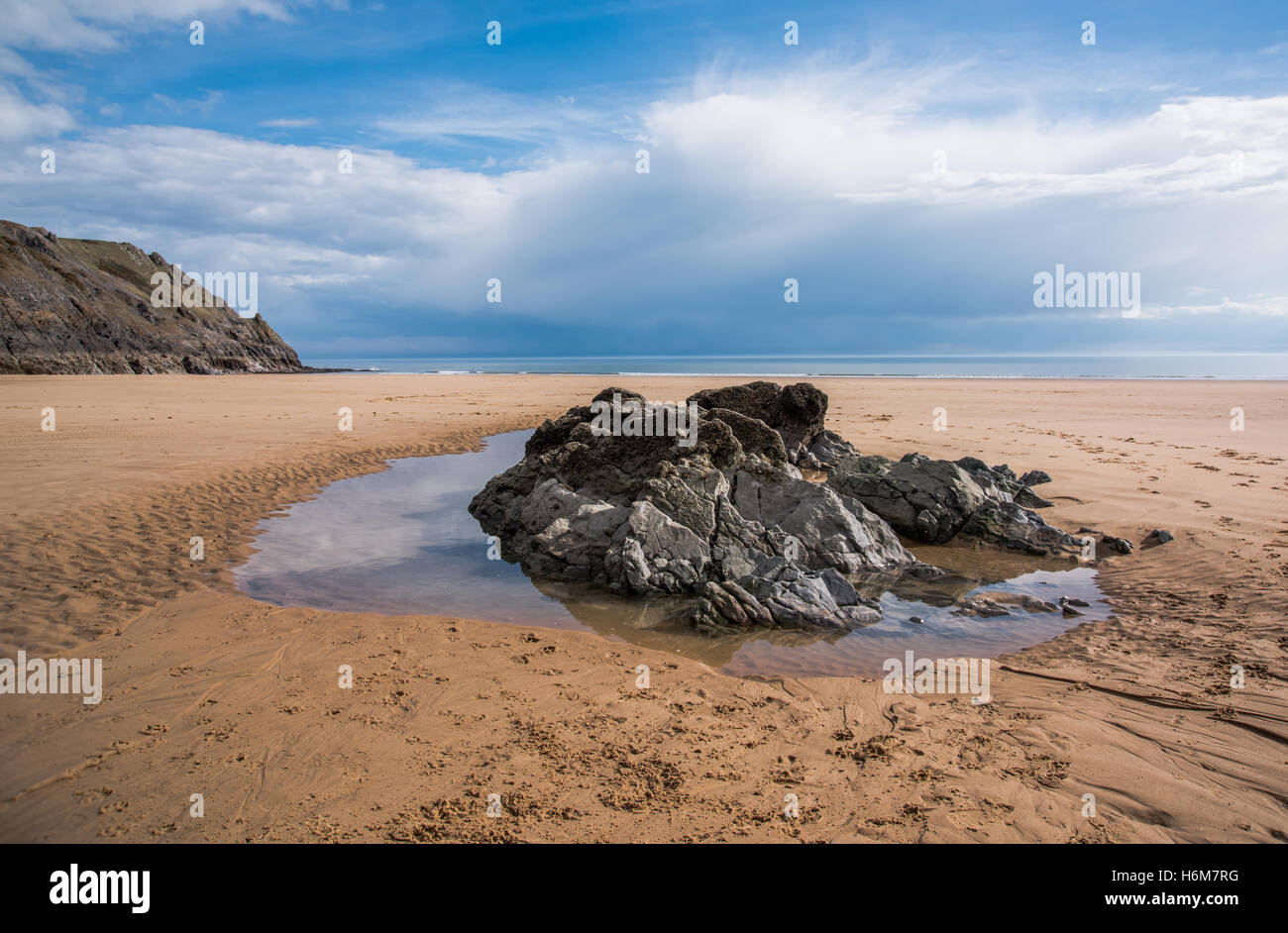 Distant storm over the North Devon coast seen from Pobbles Beach, Three ...