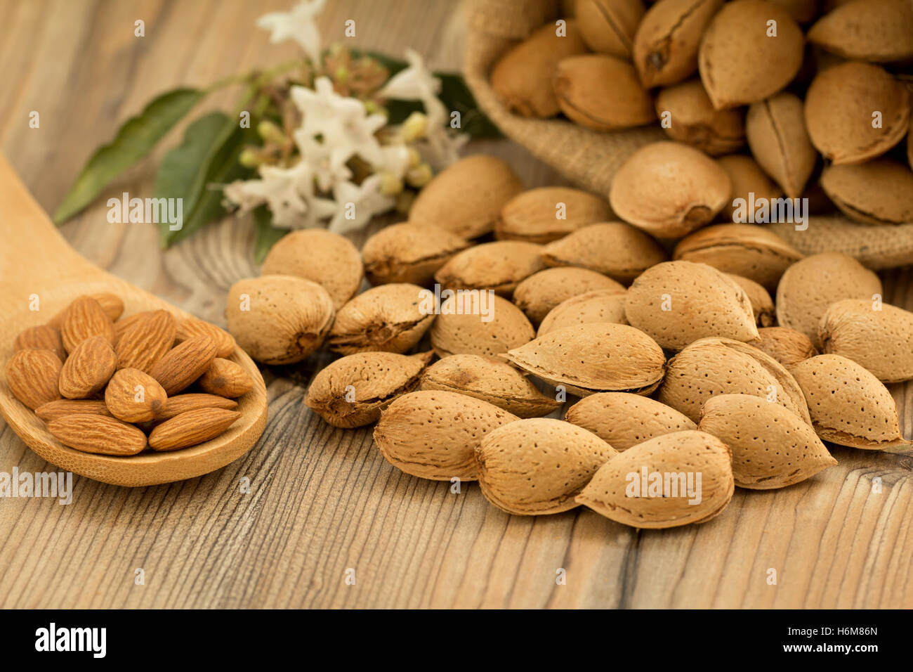 Almonds on brown wooden background. Beneficials for the brain Stock ...