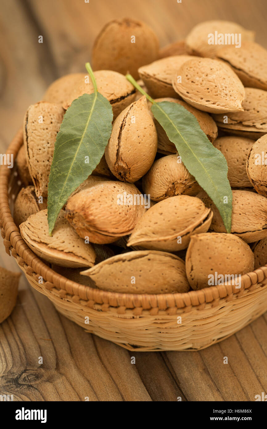 Almonds on brown wooden background. Beneficials for the brain Stock ...