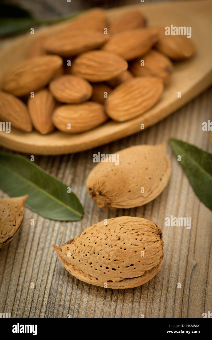 Almonds on brown wooden background. Beneficials for the brain Stock ...