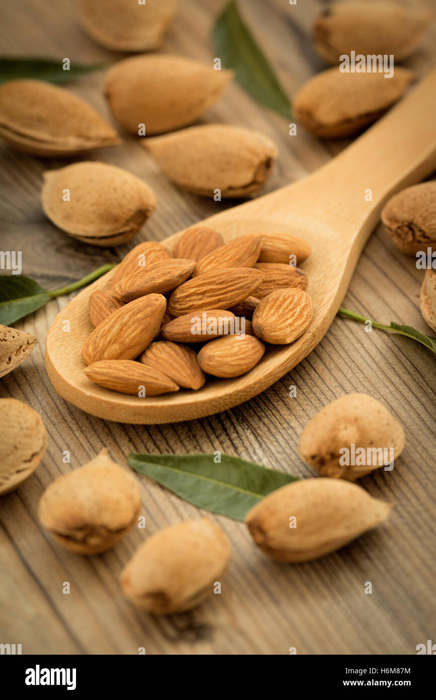 Almonds on brown wooden background. Beneficials for the brain Stock ...