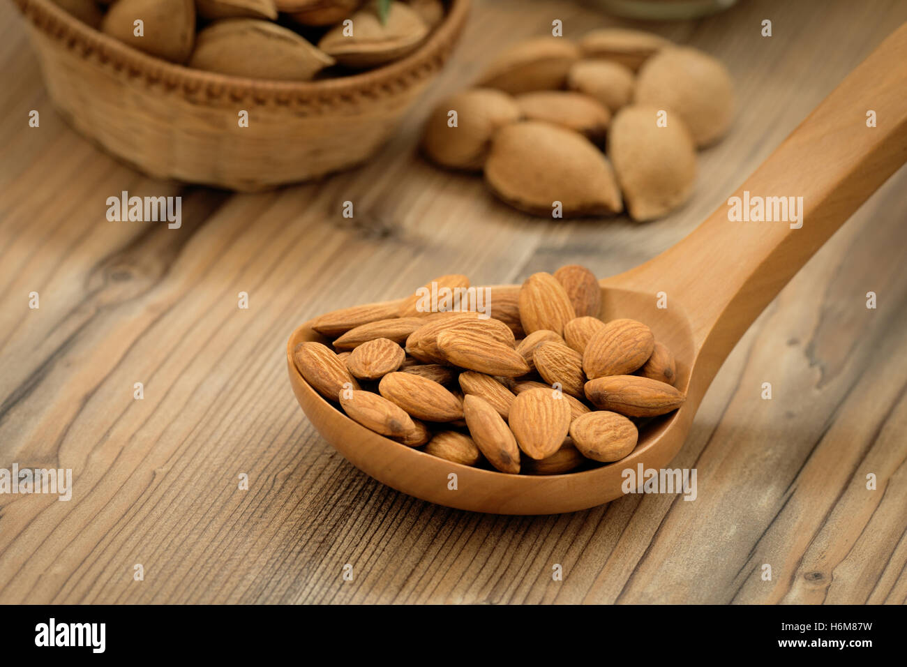 Almonds on brown wooden background. Beneficials for the brain Stock ...