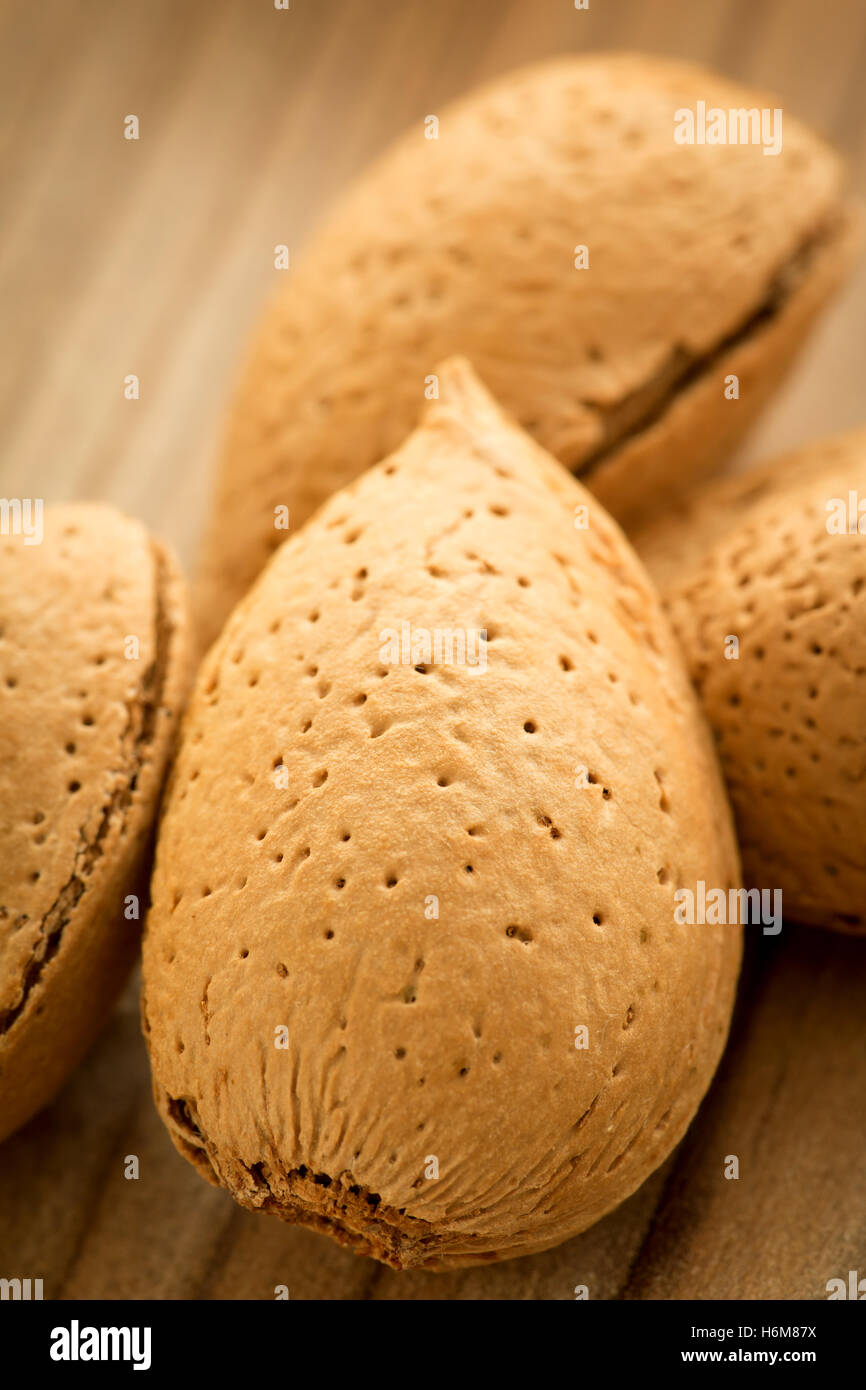 Almonds on brown wooden background. Beneficials for the brain Stock ...